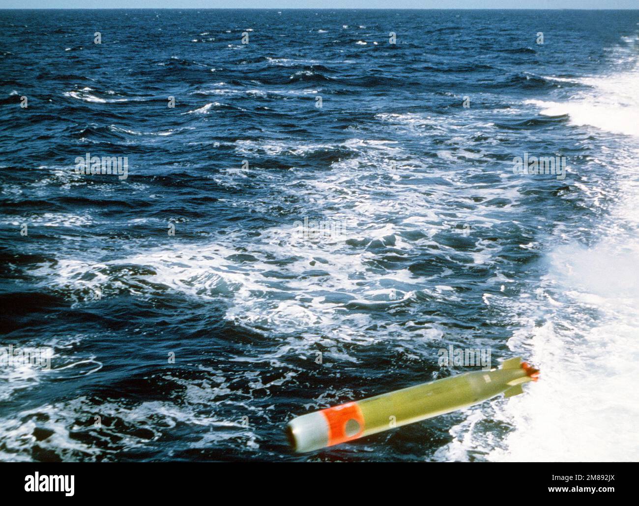 A Mark 46 torpedo is launched from the destroyer USS STUMP (DD-978 ...