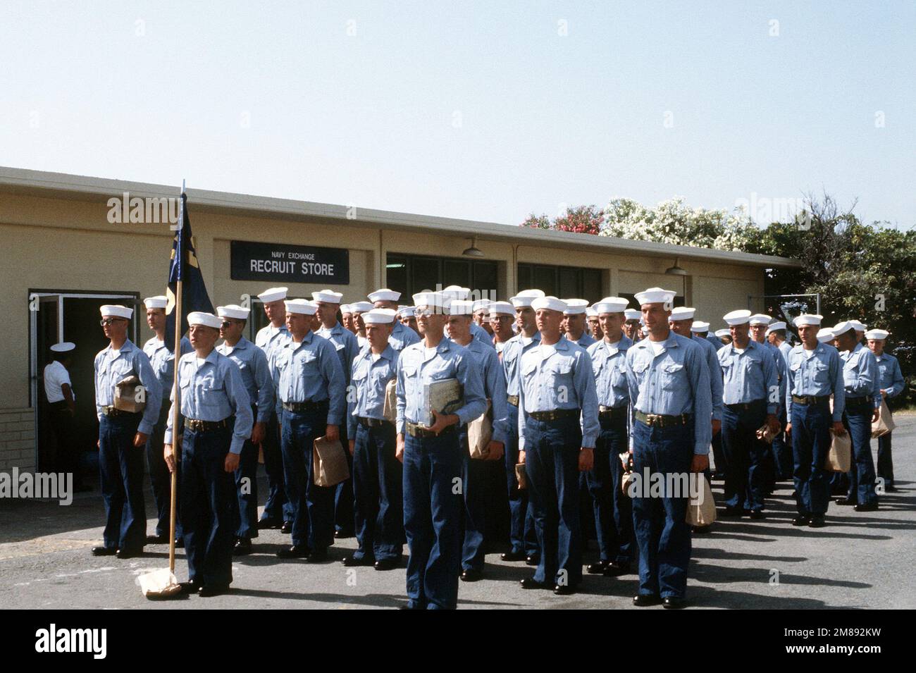 Recruits stand in formation during boot camp activities at the Naval ...