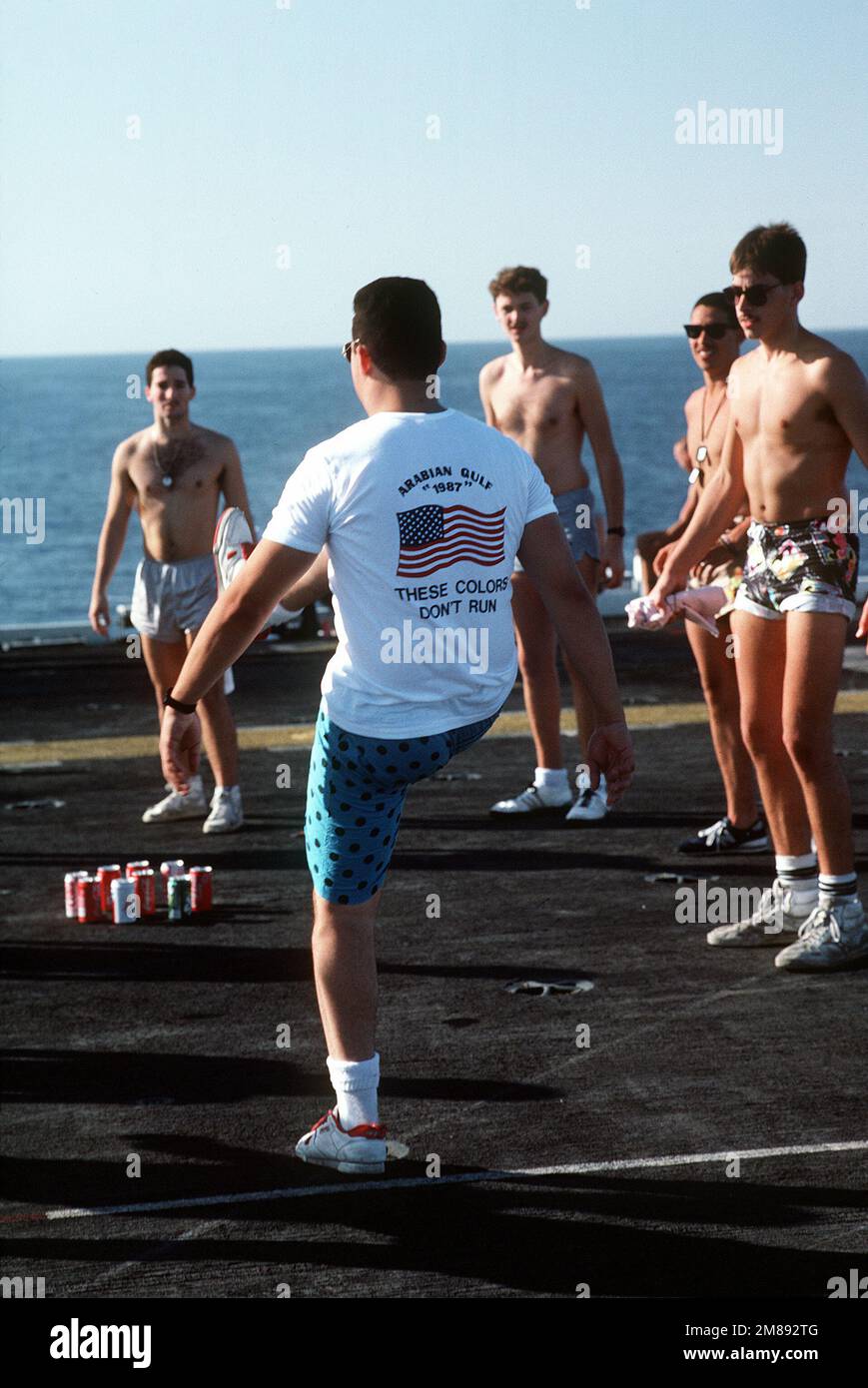 Crew members play hackie-sack on the flight deck during a steel beach ...
