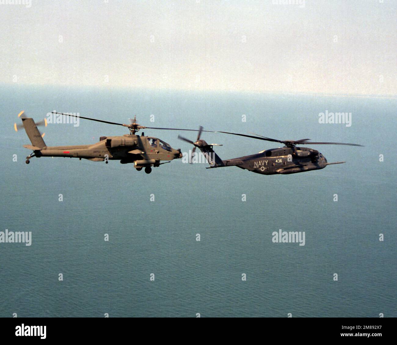 An air-to-air right side view of a Helicopter Mine Countermeasures ...