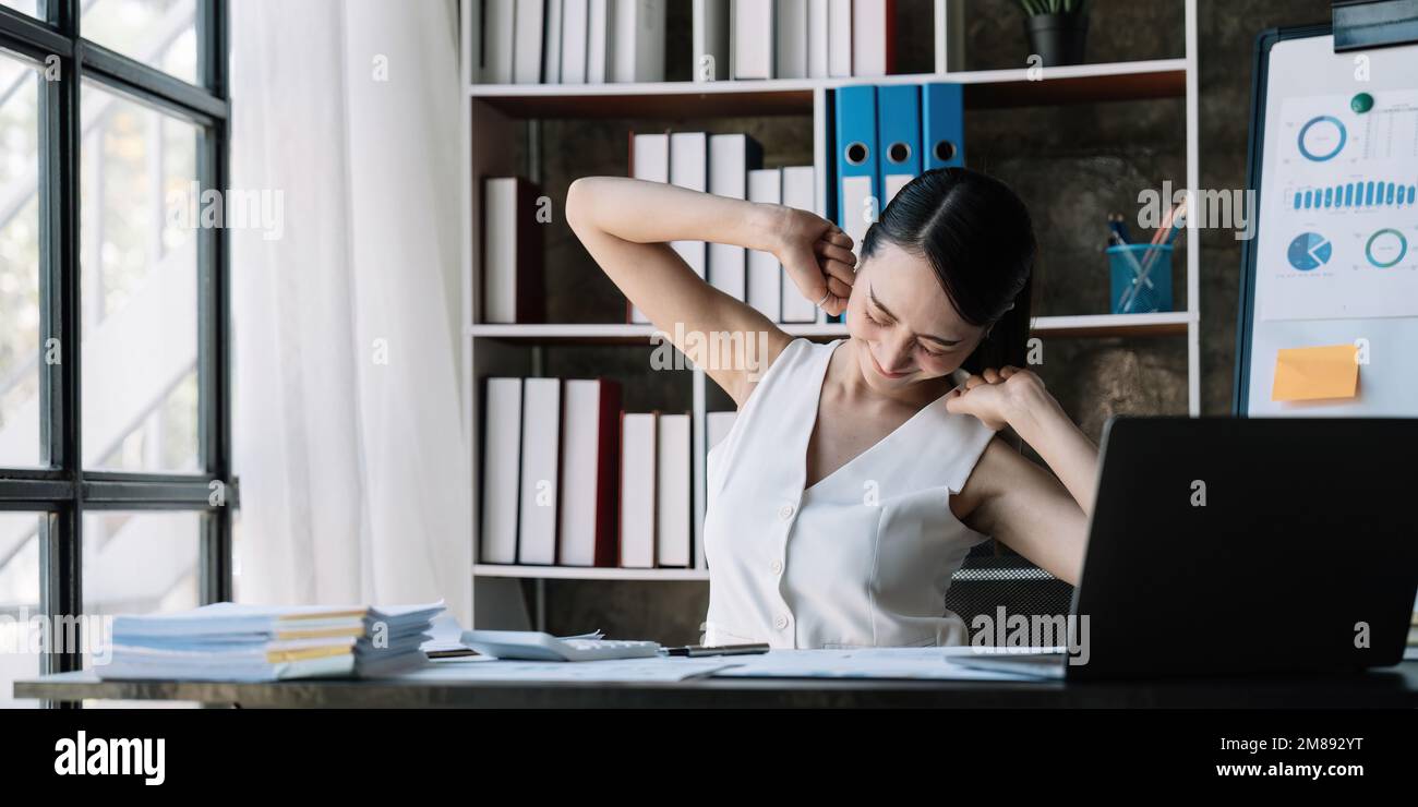 Businesswoman or working lady is stretch themselves or lazily for ...