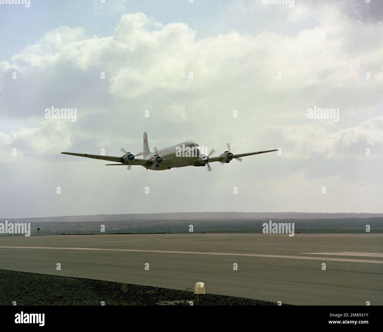 A C-118 Liftmaster aircraft becomes airborne. Base: Naval Air Station ...