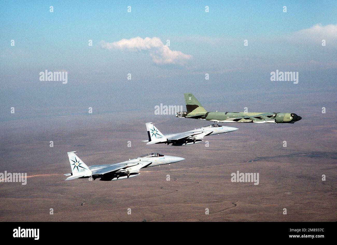 An air-to-air right side view of two F-15 Eagle aircraft of Detachment ...