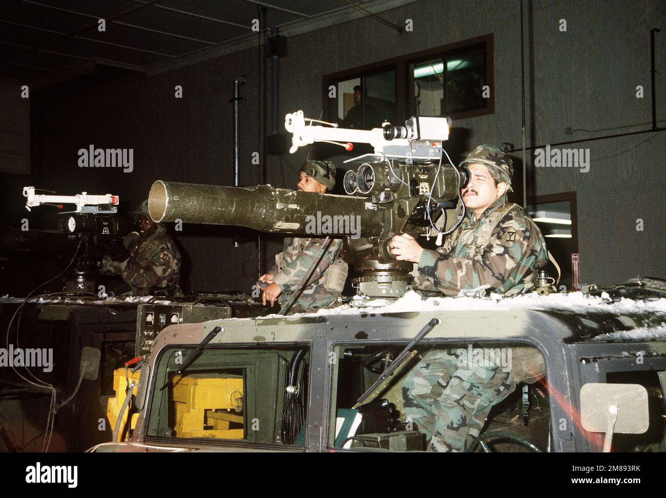 A soldier from the 1ST Battalion, 104th Infantry, aims a tube-launched ...