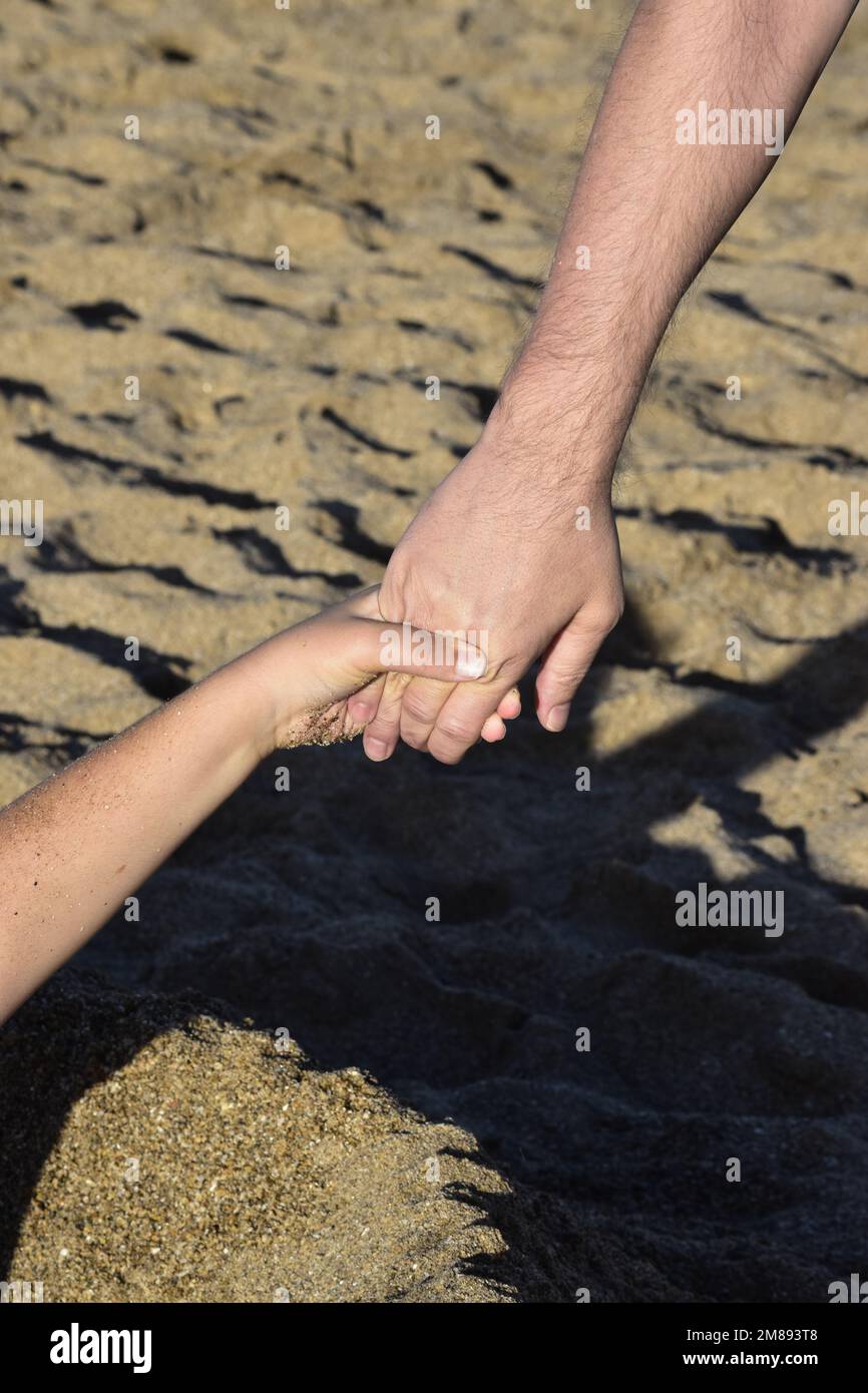 hand of a father and his son Stock Photo - Alamy
