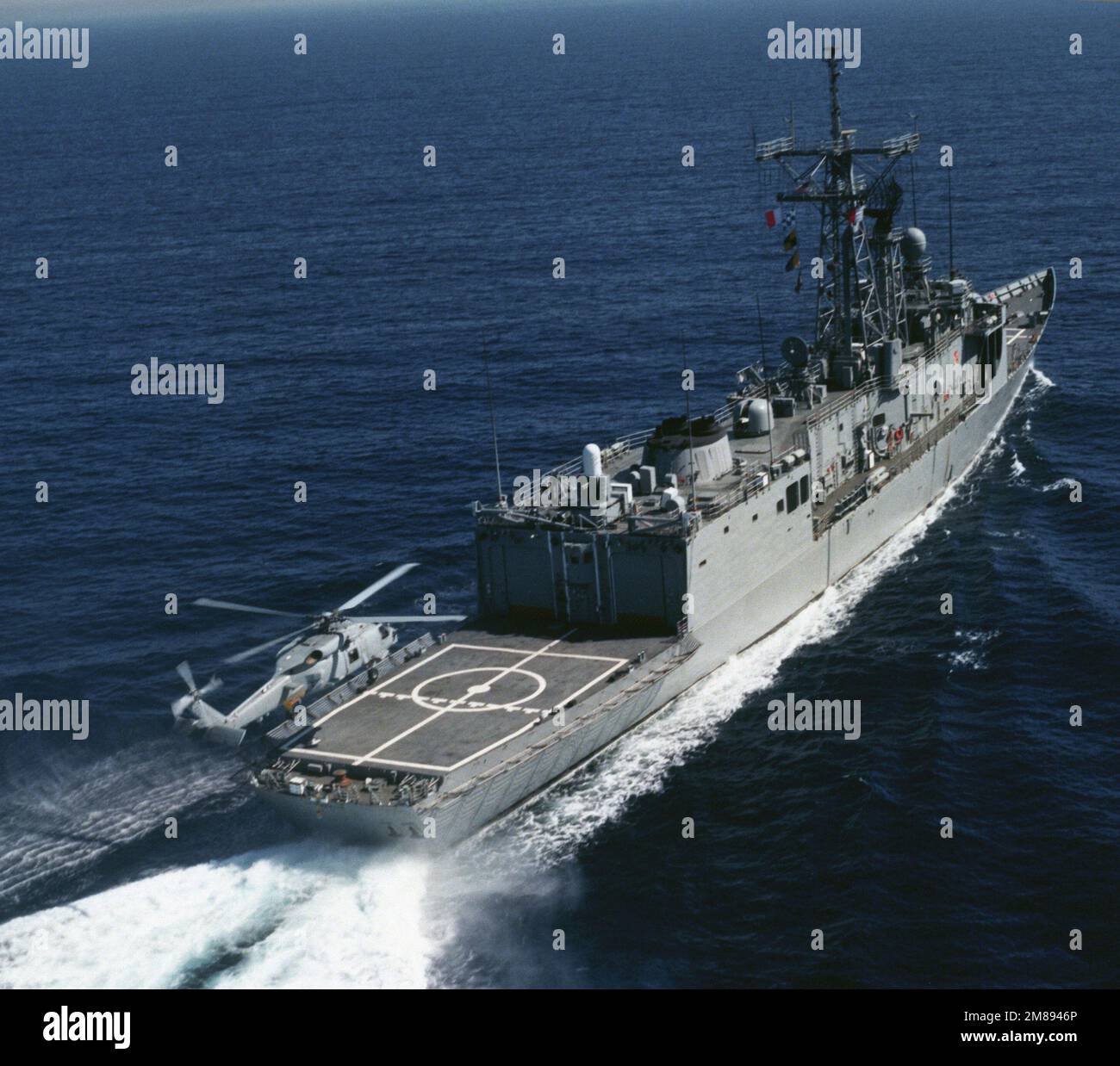 Aerial, starboard stern view, of a US Navy (USN) SH-60B Seahawk ...