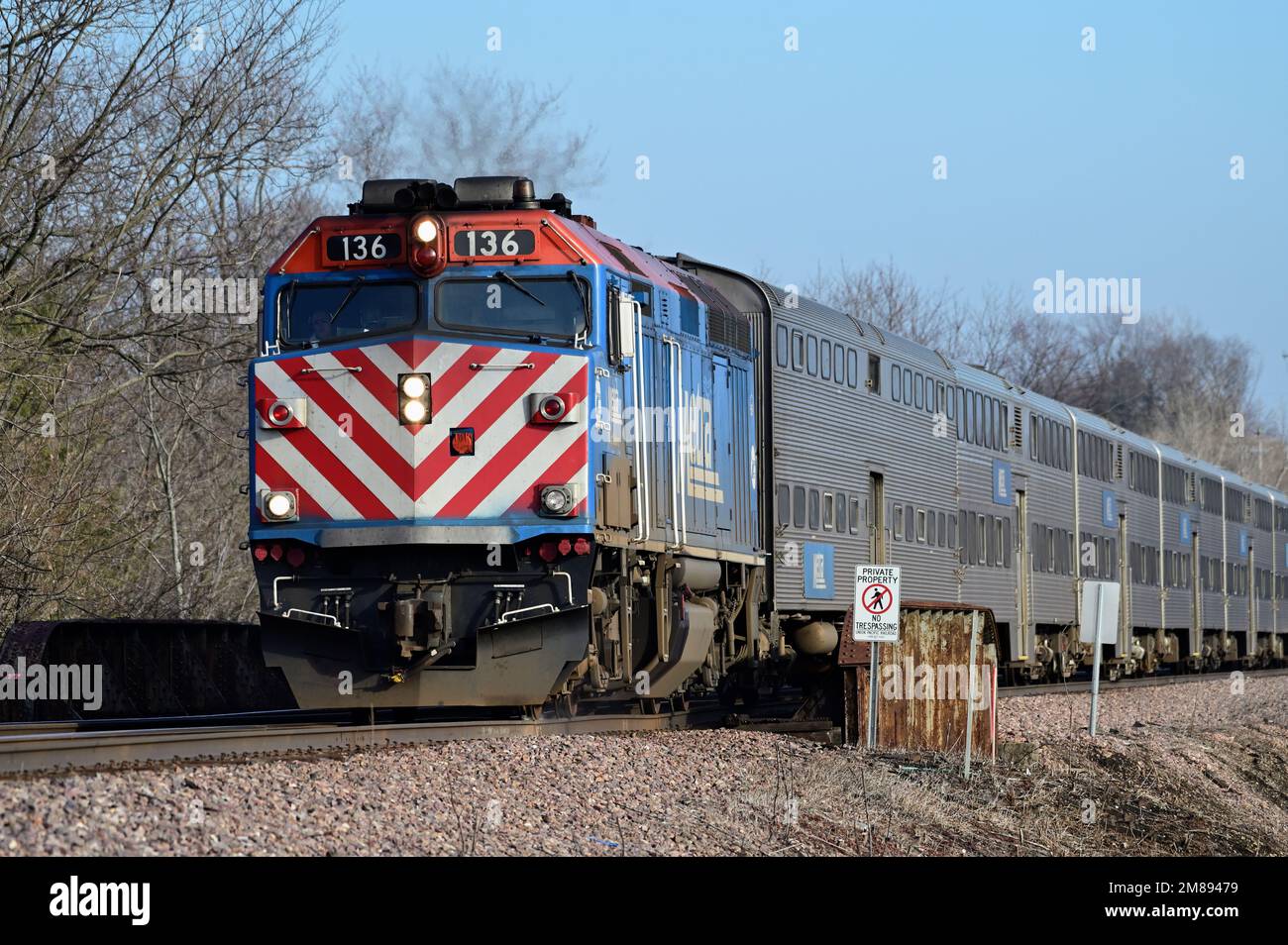Geneva, Illinois, USA. A Metra locomotive pulling its commuter train from Chicago as it nears ...