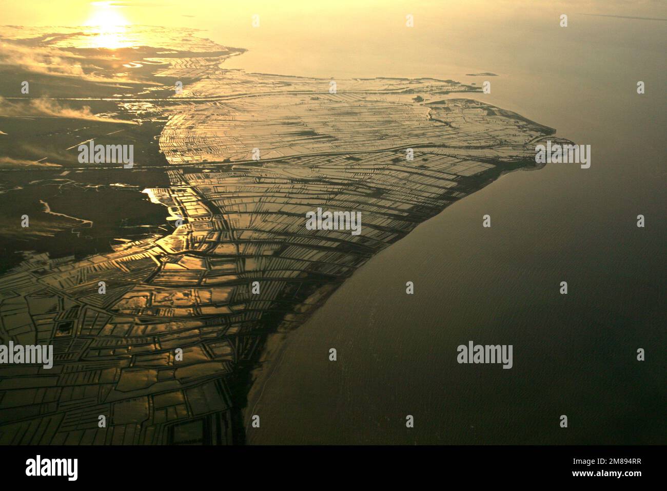 Aerial view of coastal landscape showing aquaculture farms and salt ...