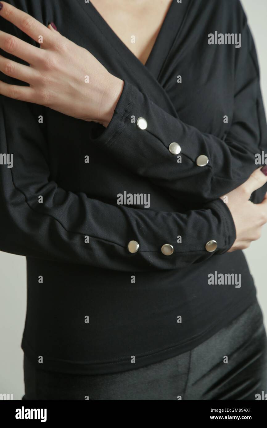 Studio photo of young female model wearing black cotton shirt with ...