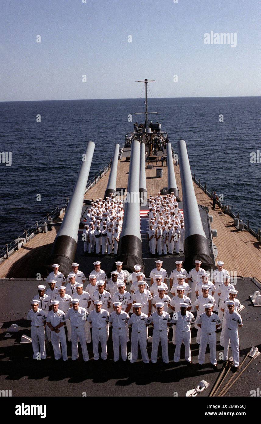 One hundred thirty-three crew members pose for a photo on top of the ...