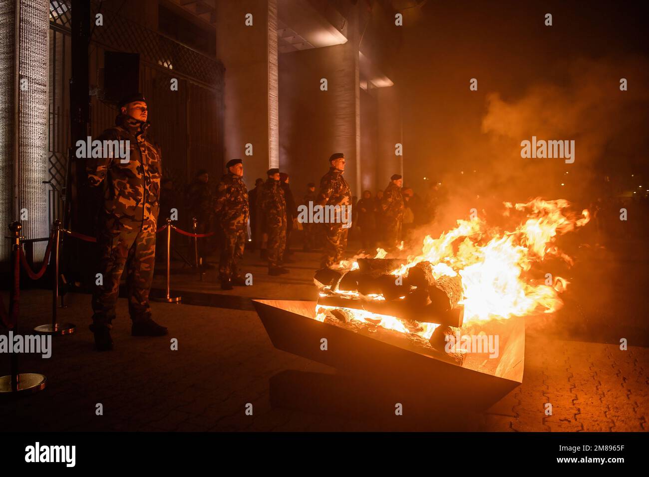 Lithuanian soldiers stand on guard as bonfires burn at the Independence ...