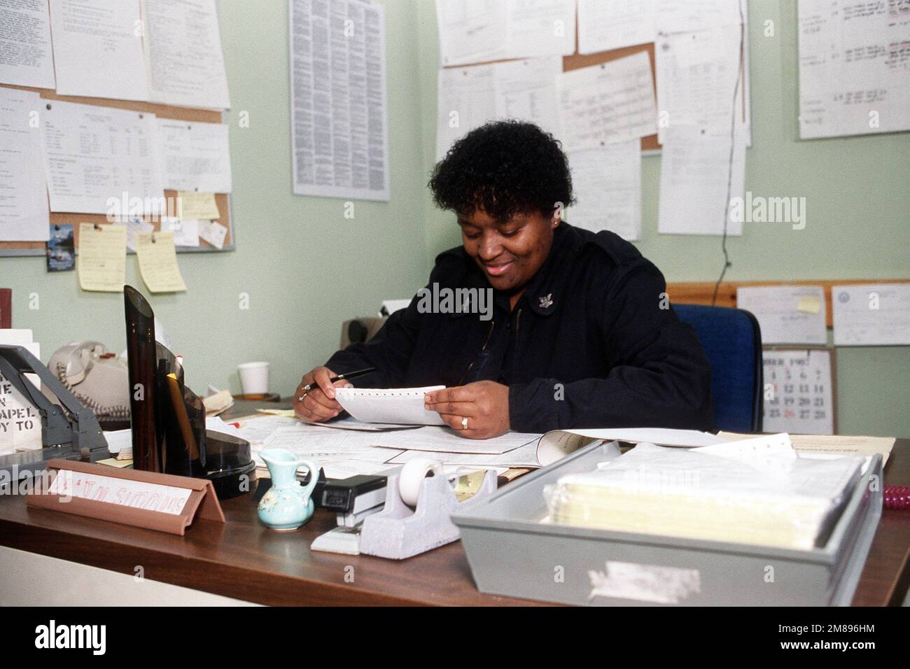 Religious Program SPECIALIST 2nd Class Jacquelyn Simmons looks over a ...