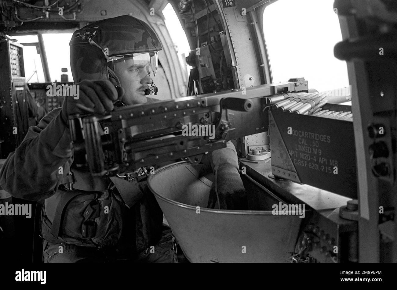 CPL. Jeffrey D. Chandler mans a .50-caliber machine gun aboard a Marine ...