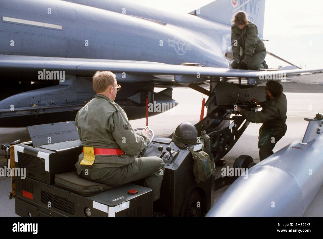 Members of the 37th Aircraft Generation Squadron use an MJ-1 weapons ...