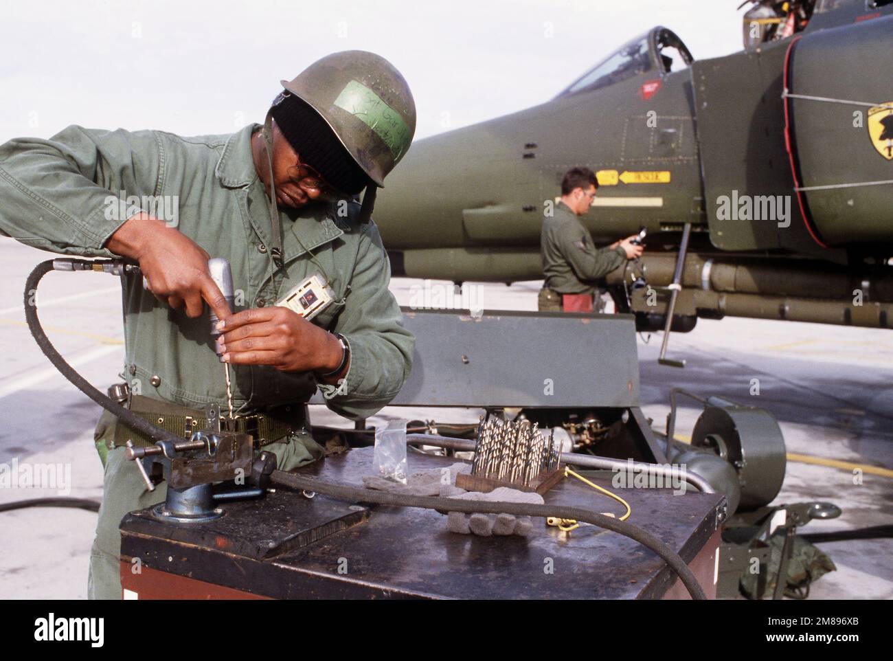 SGT Barry Garvin of the 37th Aircraft Generation Squadron drills a ...