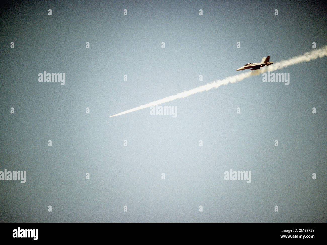 A TF/A-18 Hornet aircraft fires a rocket during Exercise Gallant Eagle ...
