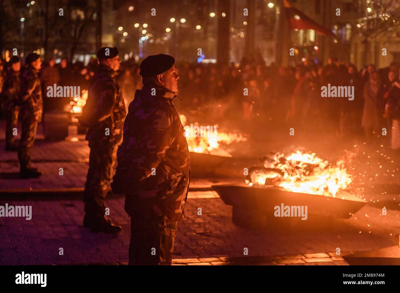 Lithuanian soldiers stand on guard as bonfires burn at the Independence ...