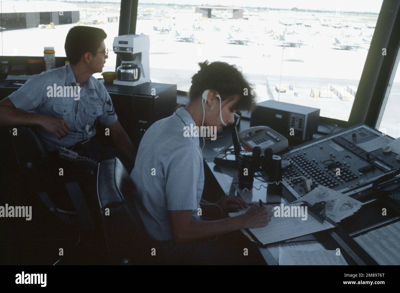 Air traffic controllers monitor flight operations from the control ...