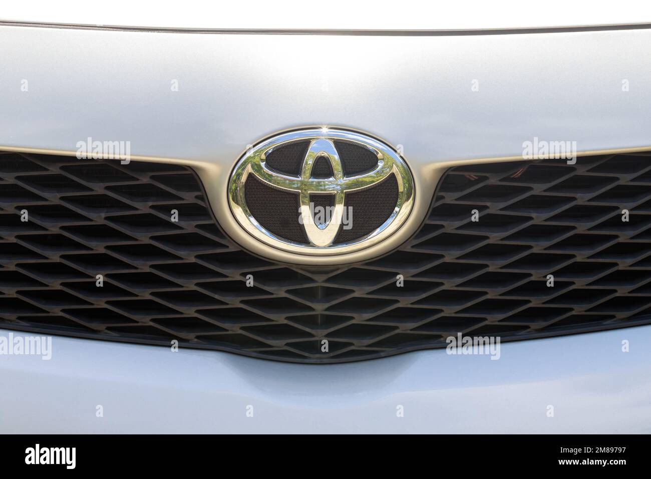 An image of the Toyota logo can be seen on the front of the car Stock ...