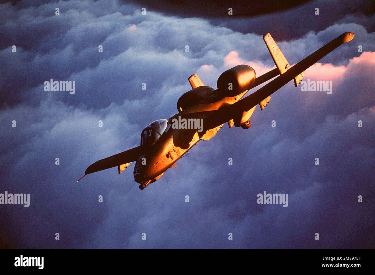 An air-to-air left front view of an A-10A Thunderbolt II aircraft ...