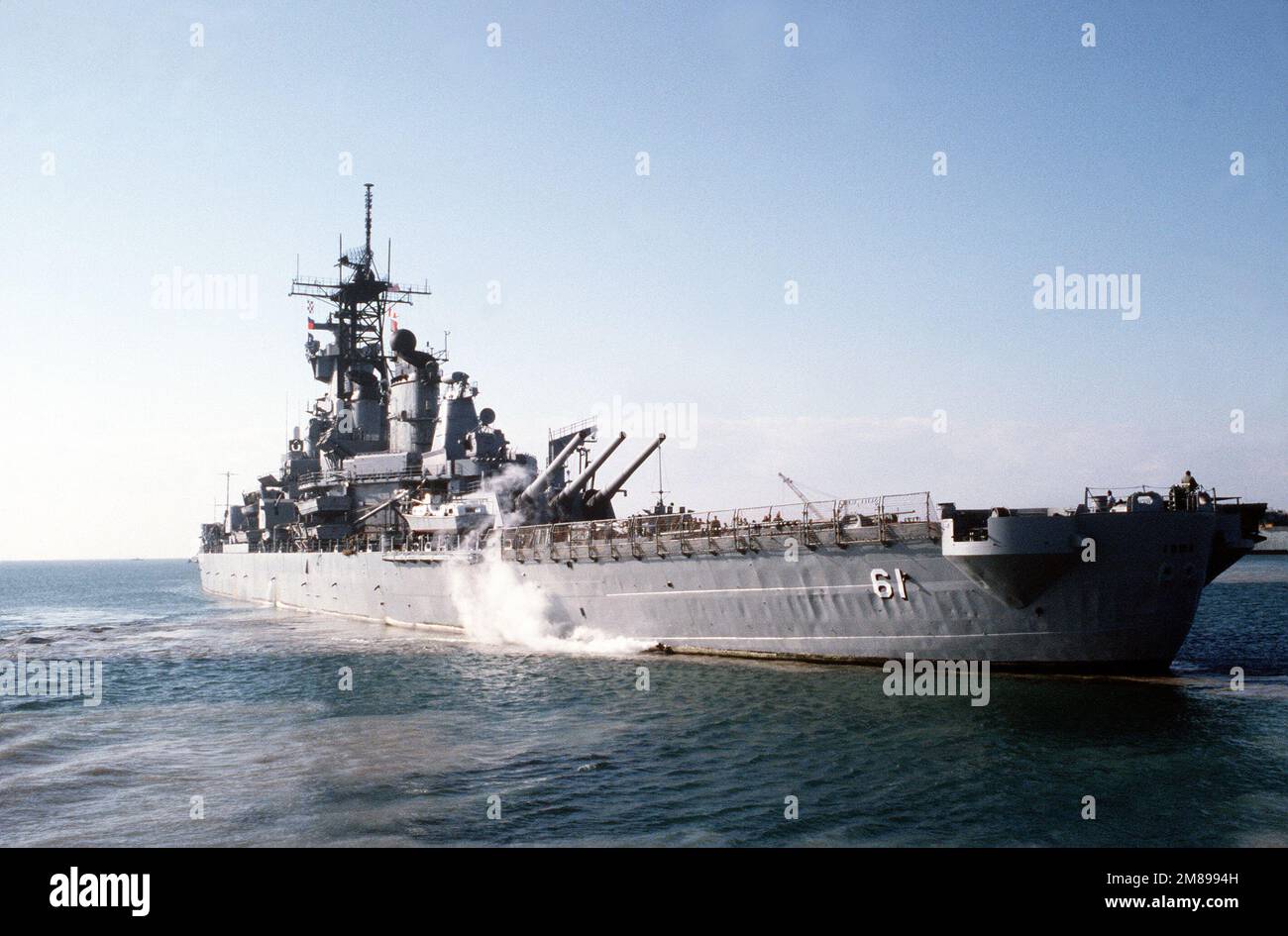 A port quarter view of the battleship USS IOWA (BB 61) as it departs ...