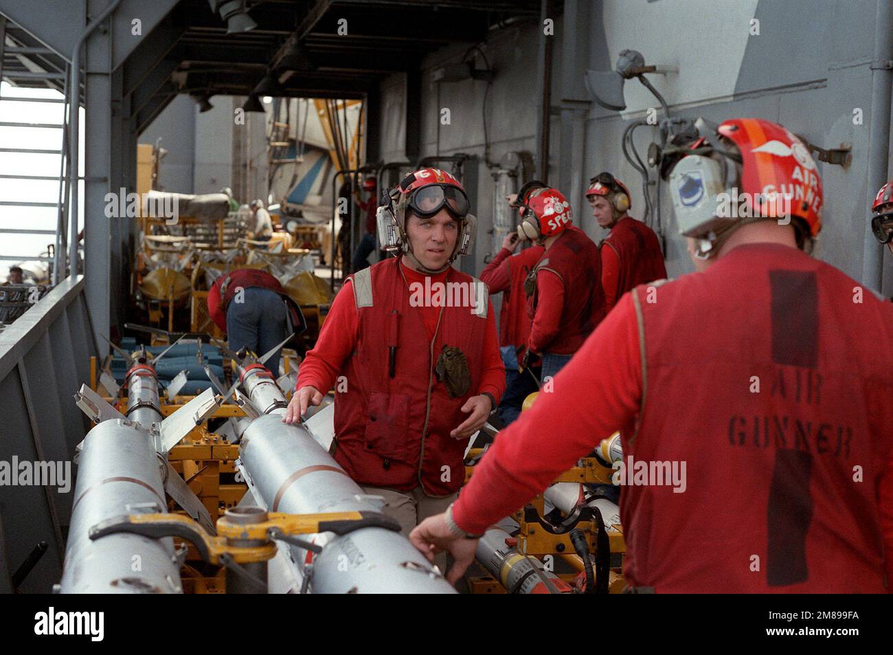 Aviation ordnancemen aboard the nuclear-powered aircraft carrier USS ...