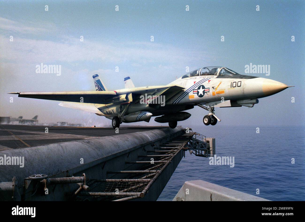 A Fighter Squadron 143 (VF-143) F-14A Tomcat aircraft clears the ...