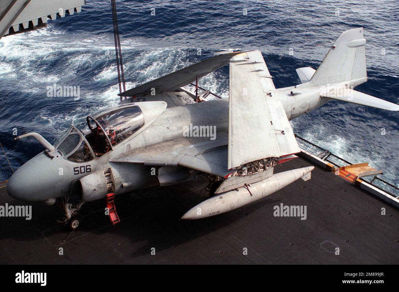 An aircraft elevator is used to move an Attack Squadron 34 (VA-34) A-6E ...