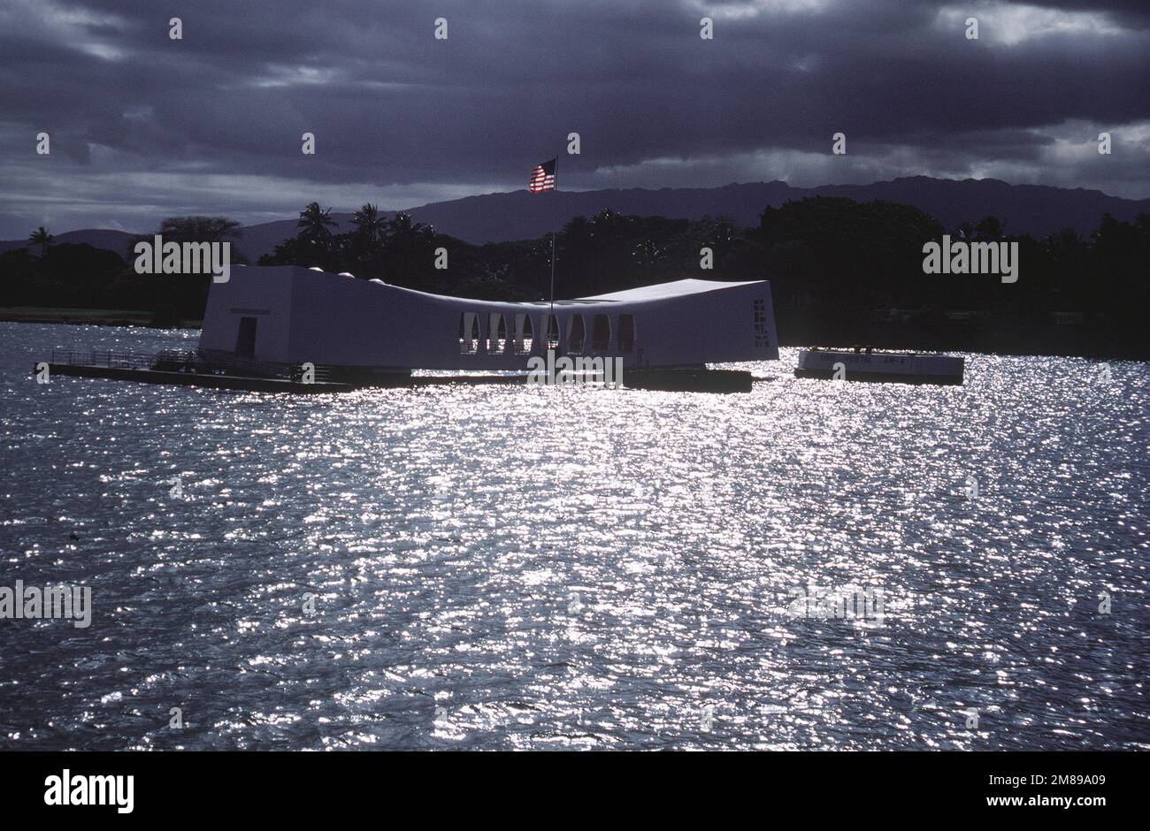 The American flag flies over the USS ARIZONA (BB-39) Memorial as the ...