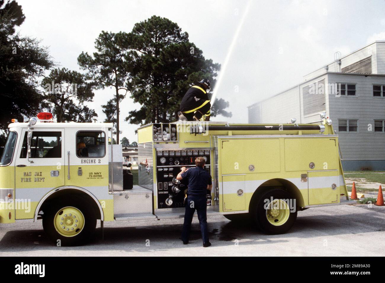 LT Rosbottom monitors the water pressure gauges on the side of one of ...