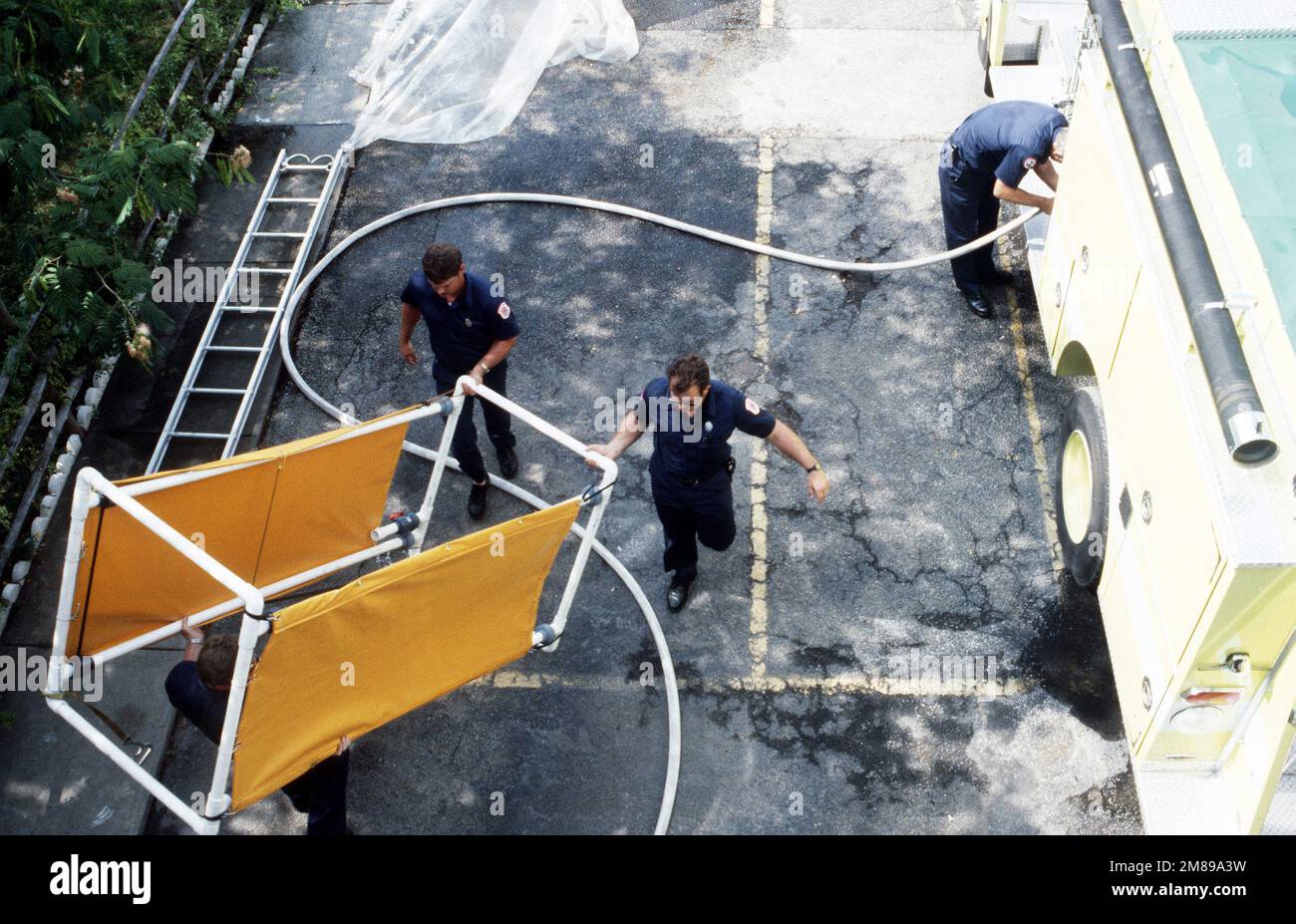 Member's of the air station fire department dismantle a portable ...