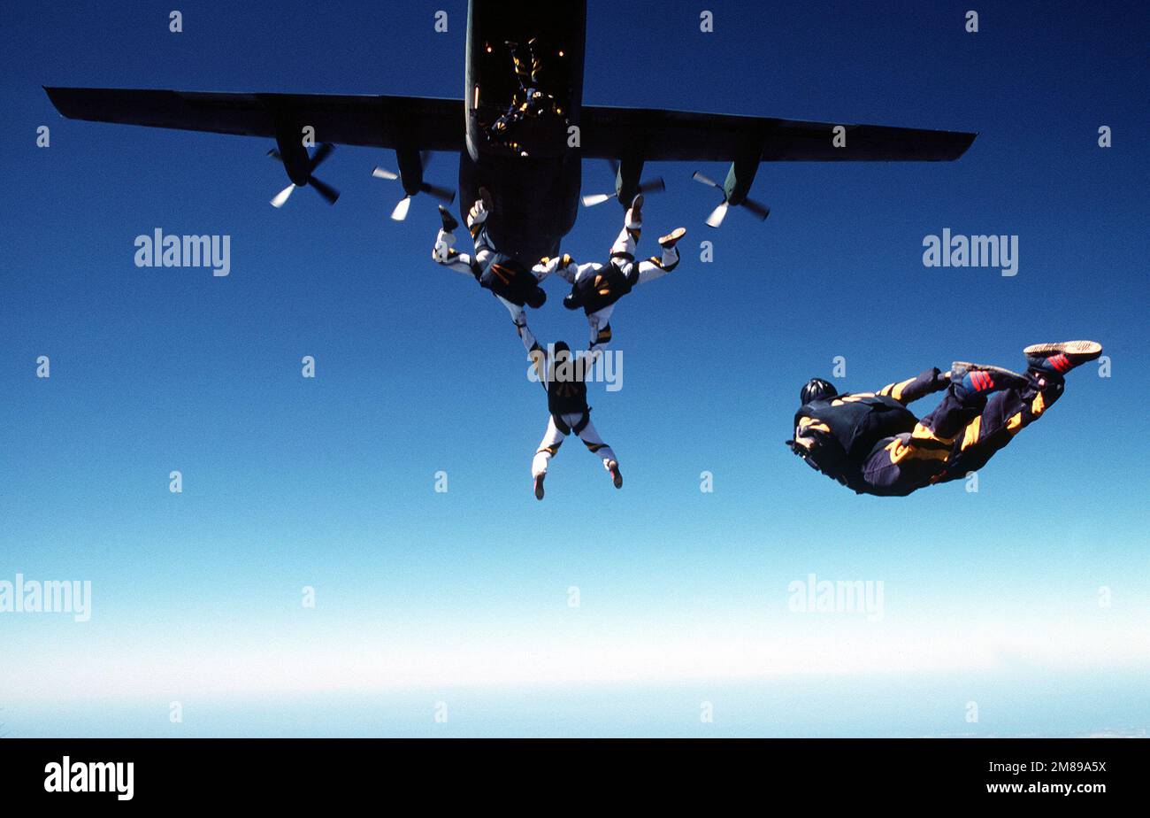 Members of the "Leapfrogs," the Navy's Parachute Team, gather into a ...