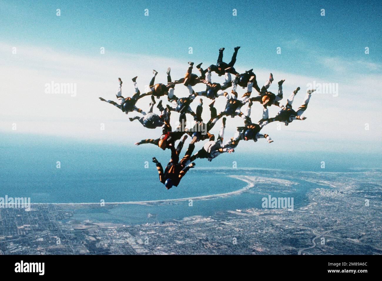 Members of the "Leapfrogs," the Navy's Parachute Team, form a 16-man ...