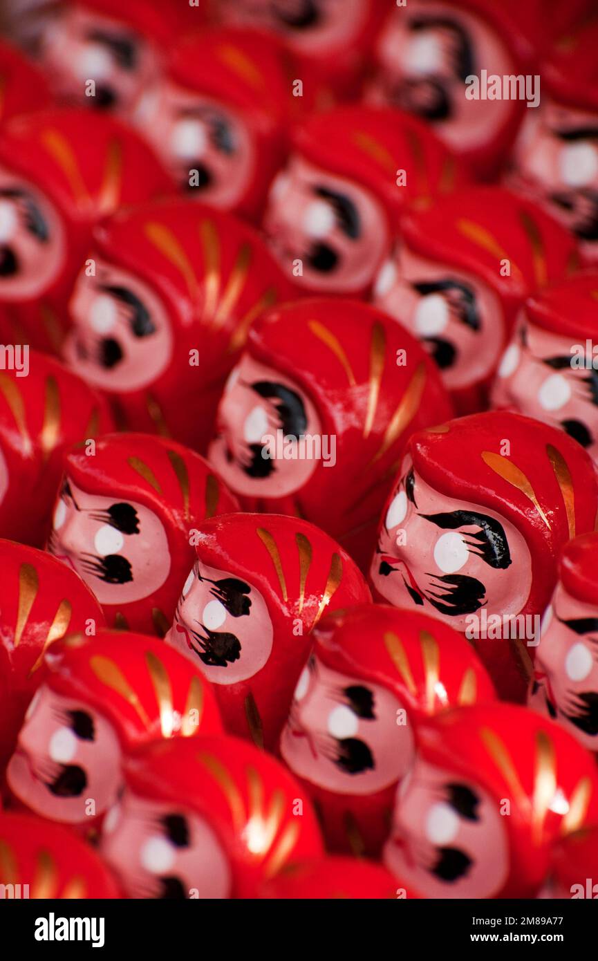 Rows of Daruma dolls for sale at New Years in Japan Stock Photo - Alamy