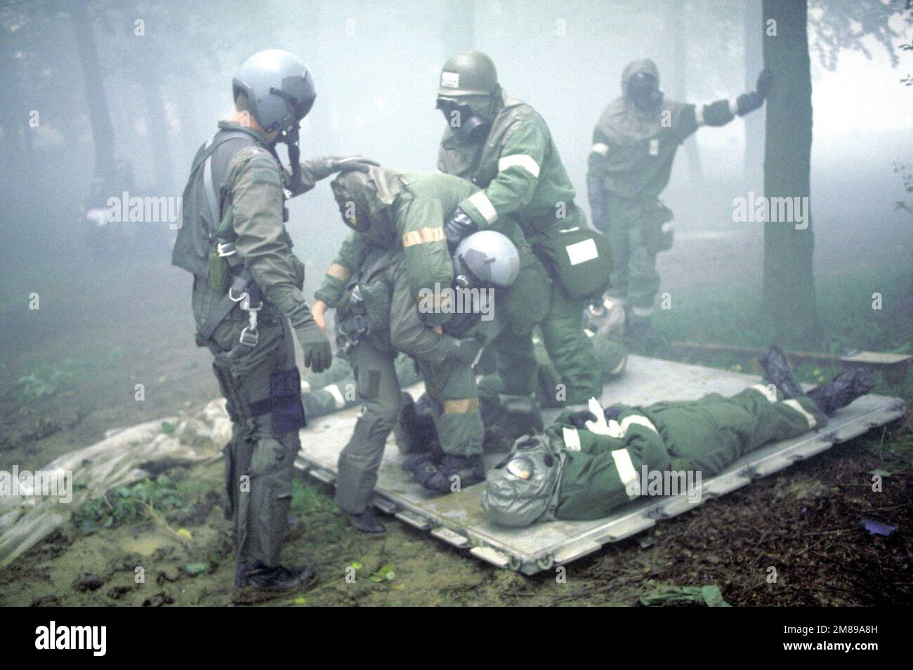 Two pilots from the 525th Tactical Fighter Squadron assist personnel in ...