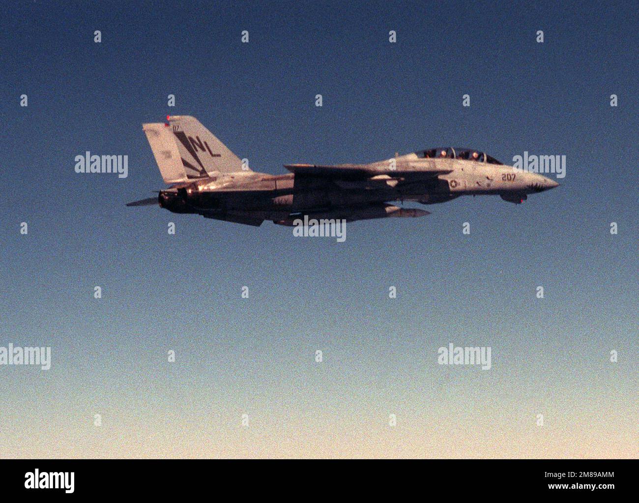 An air-to-air right side view of a Fighter Squadron 111 (VF-111) F-14A ...