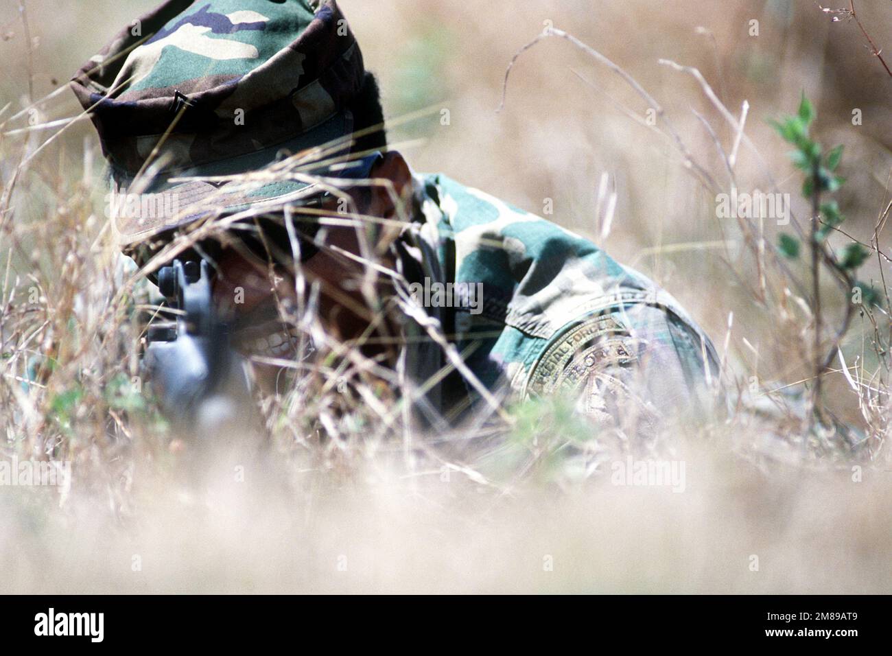 A Special Forces soldier guards the assault force at Camp Santiago ...