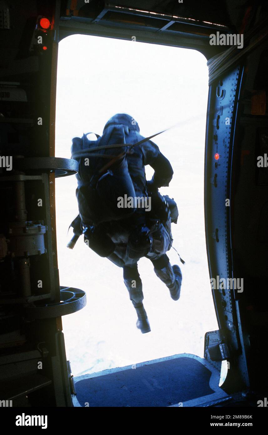 A member of the 82nd Airborne Division jumps from a C-141B Starlifter ...
