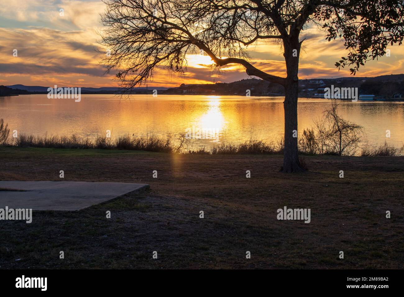 Silhouette tree at sunset over Inks Lake State Park TX, USA. Sunset ...