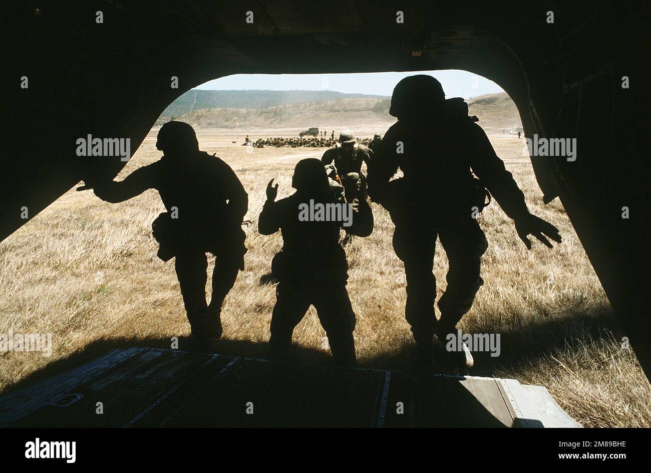 Members of the 82nd Airborne Division board a CH-47 Chinook helicopter ...
