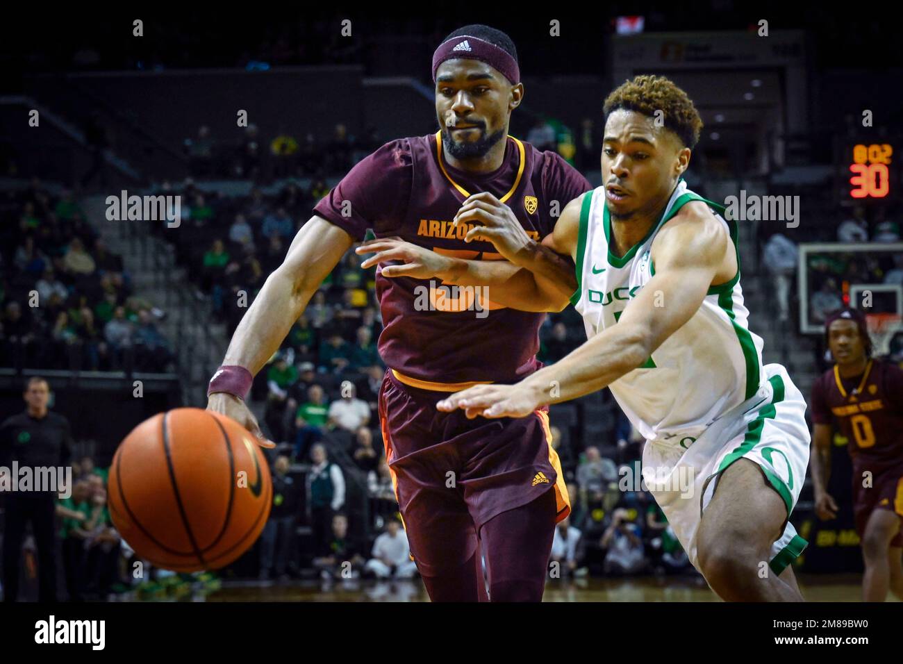 Arizona State guard Devan Cambridge, left, and Oregon guard Keeshawn ...