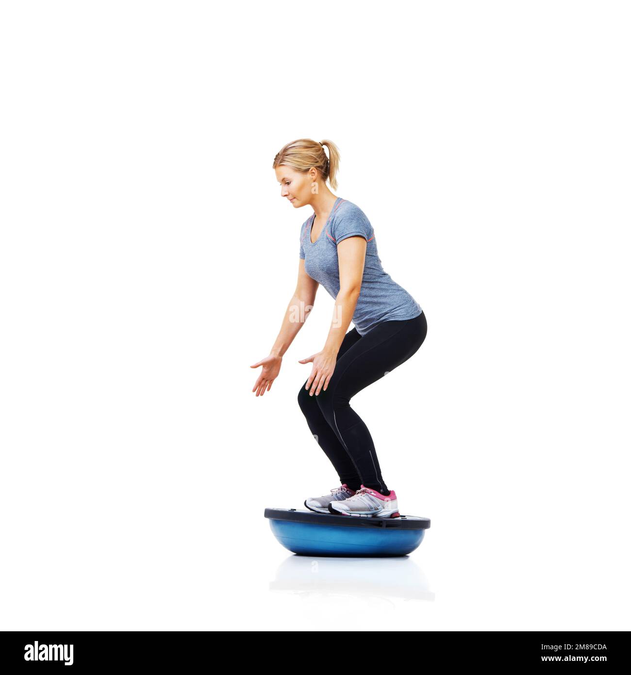 The key to core strength is balance. A beautiful young woman working ...