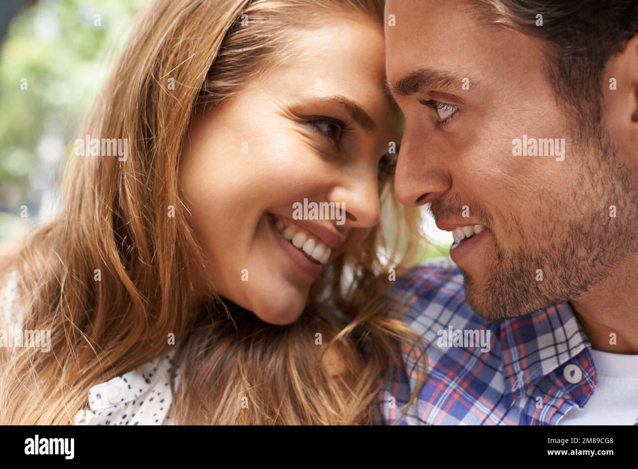 Locked in each others gaze. Closeup shot of a young couple sharing a ...