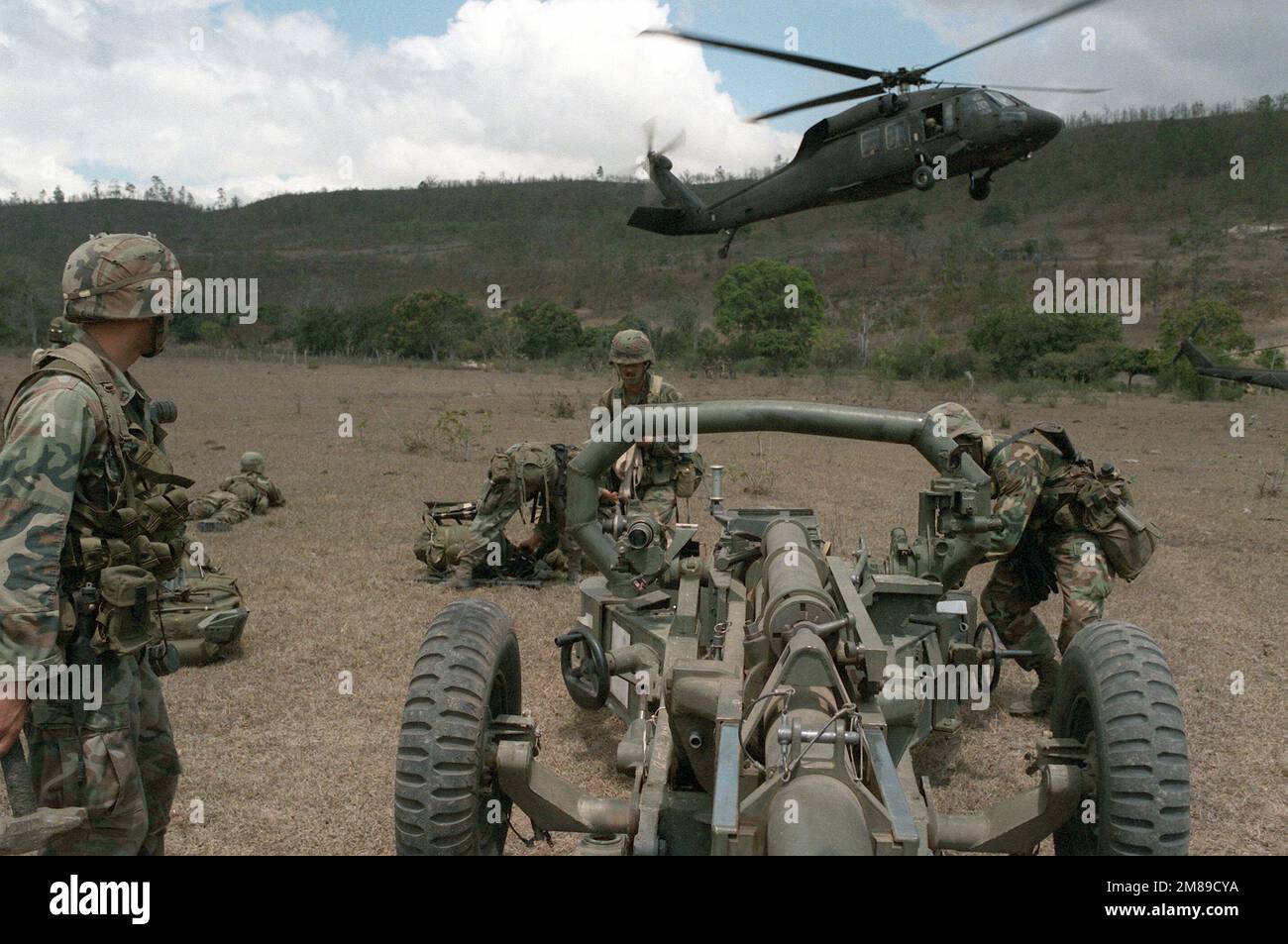 Soldiers of the 82nd Airborne Division prepare an M-102 105mm howitzer ...