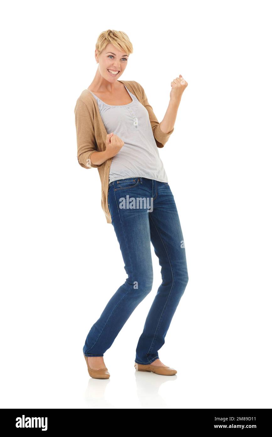 Celebration time. Full length of an excited young woman celebrating ...