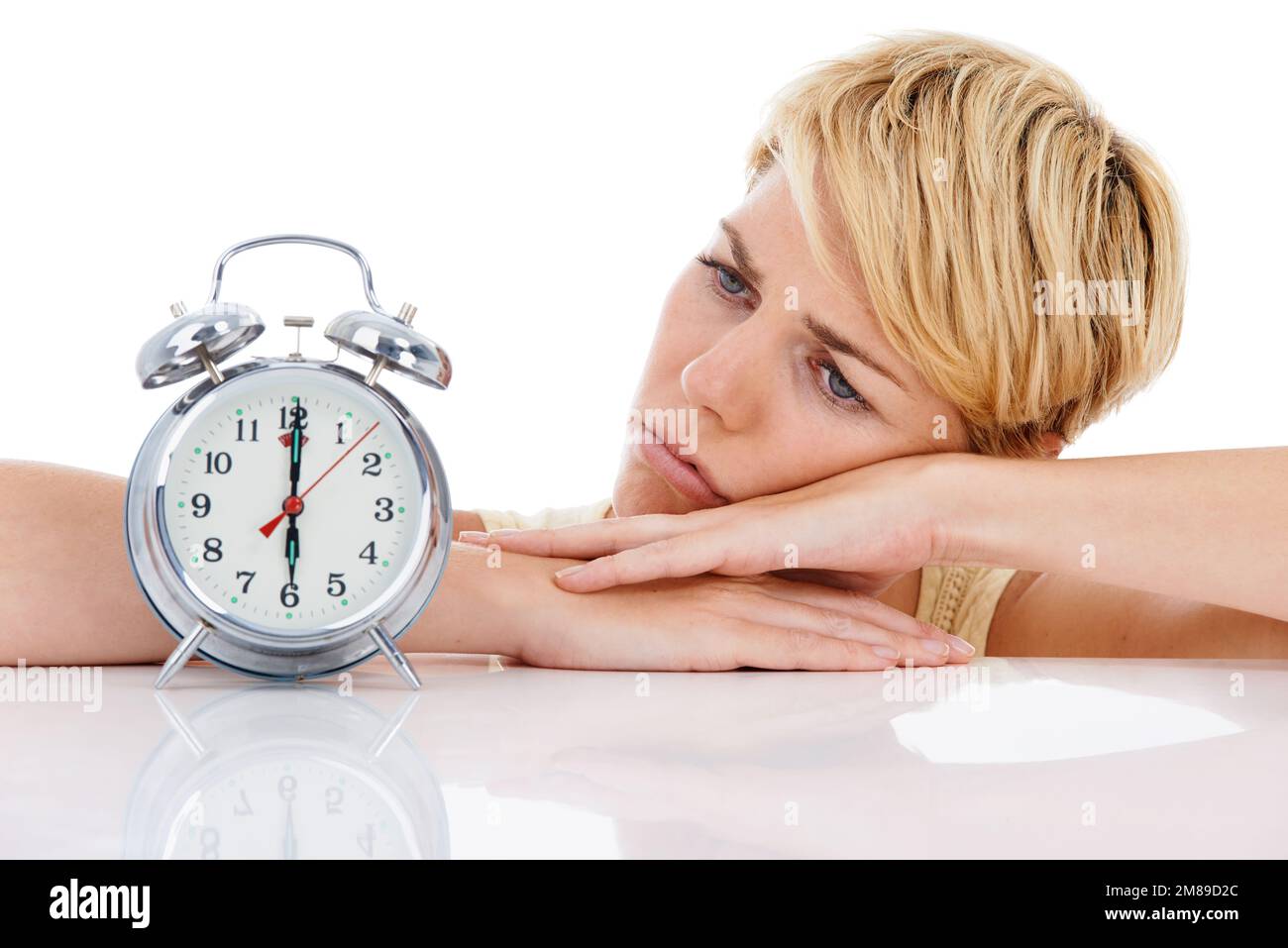 Woman staring at a clock hi-res stock photography and images - Alamy
