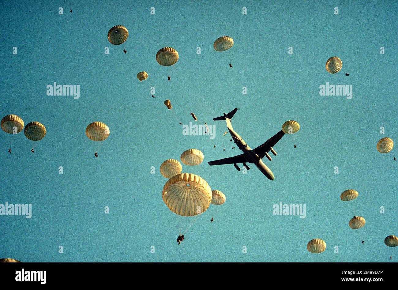 A unit of the 82nd Airborne Division parachutes from a C-141B ...