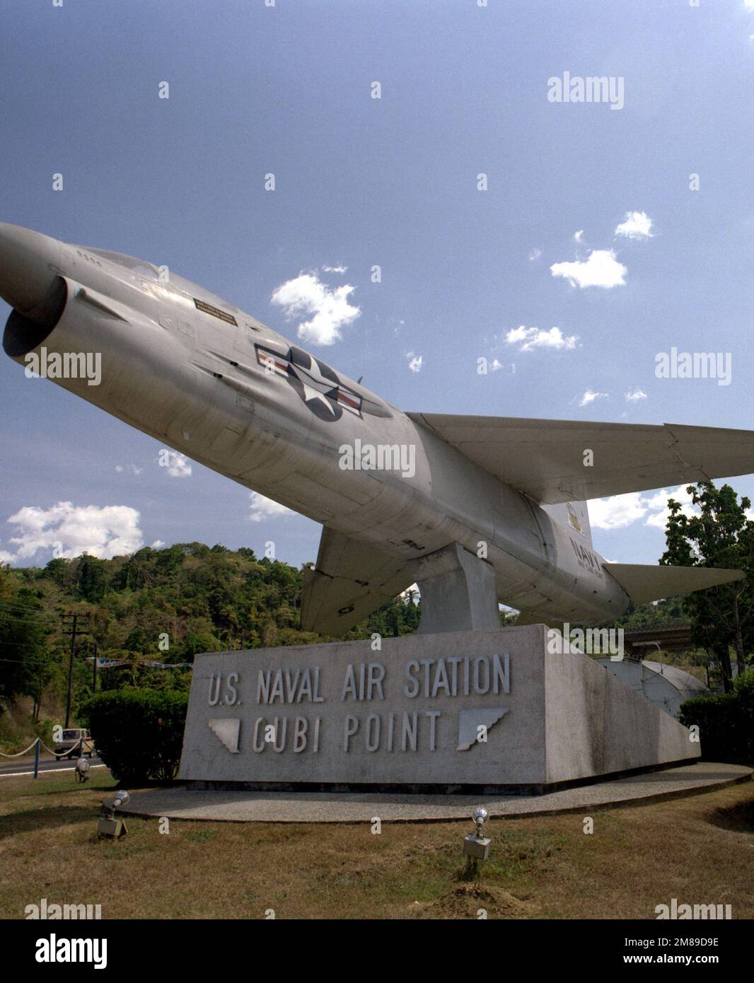 An F-8 Crusader fighter aircraft on static display at the entrance of ...