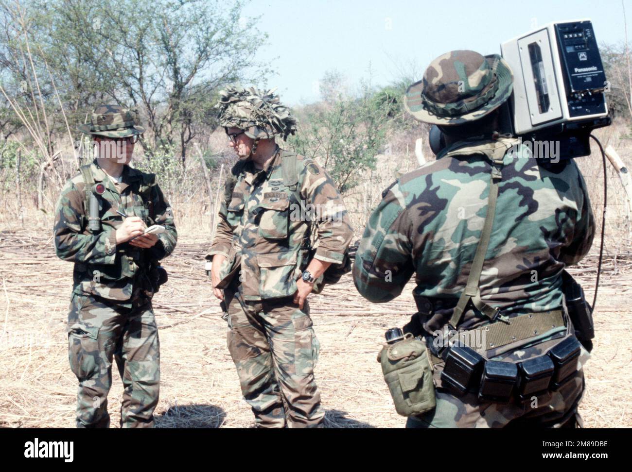 SPECIALIST Andy L. Johnson, left, talks to one of the 7th Infantry ...