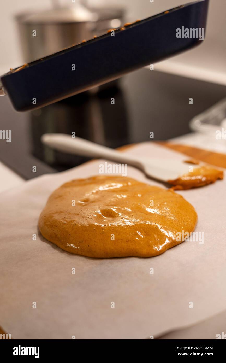 Making giant sugar cookie, dalgona and spatula on the cooking wax paper ...